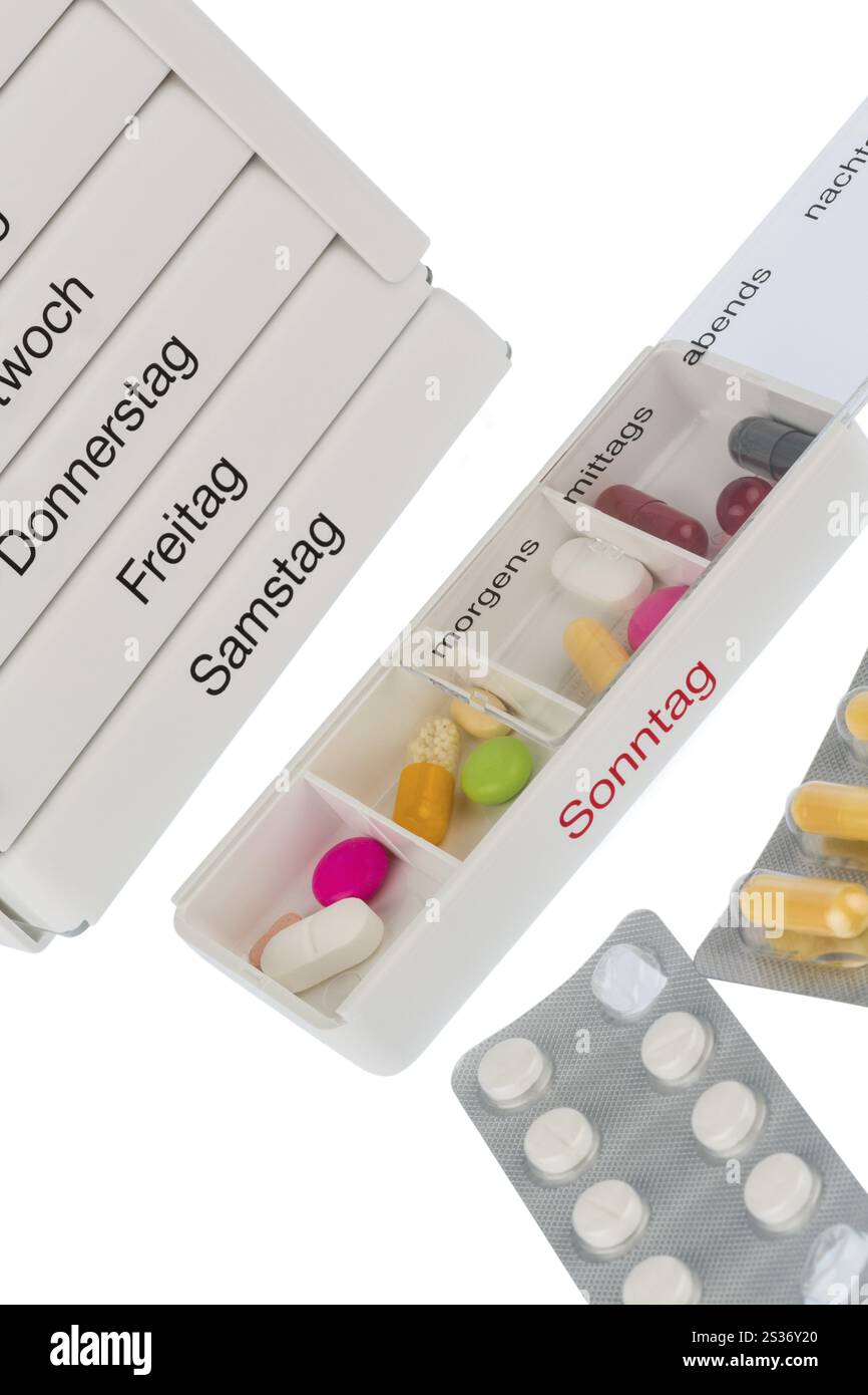 Tablet dispenser and tablets, symbol photo for therapy, prescription ...