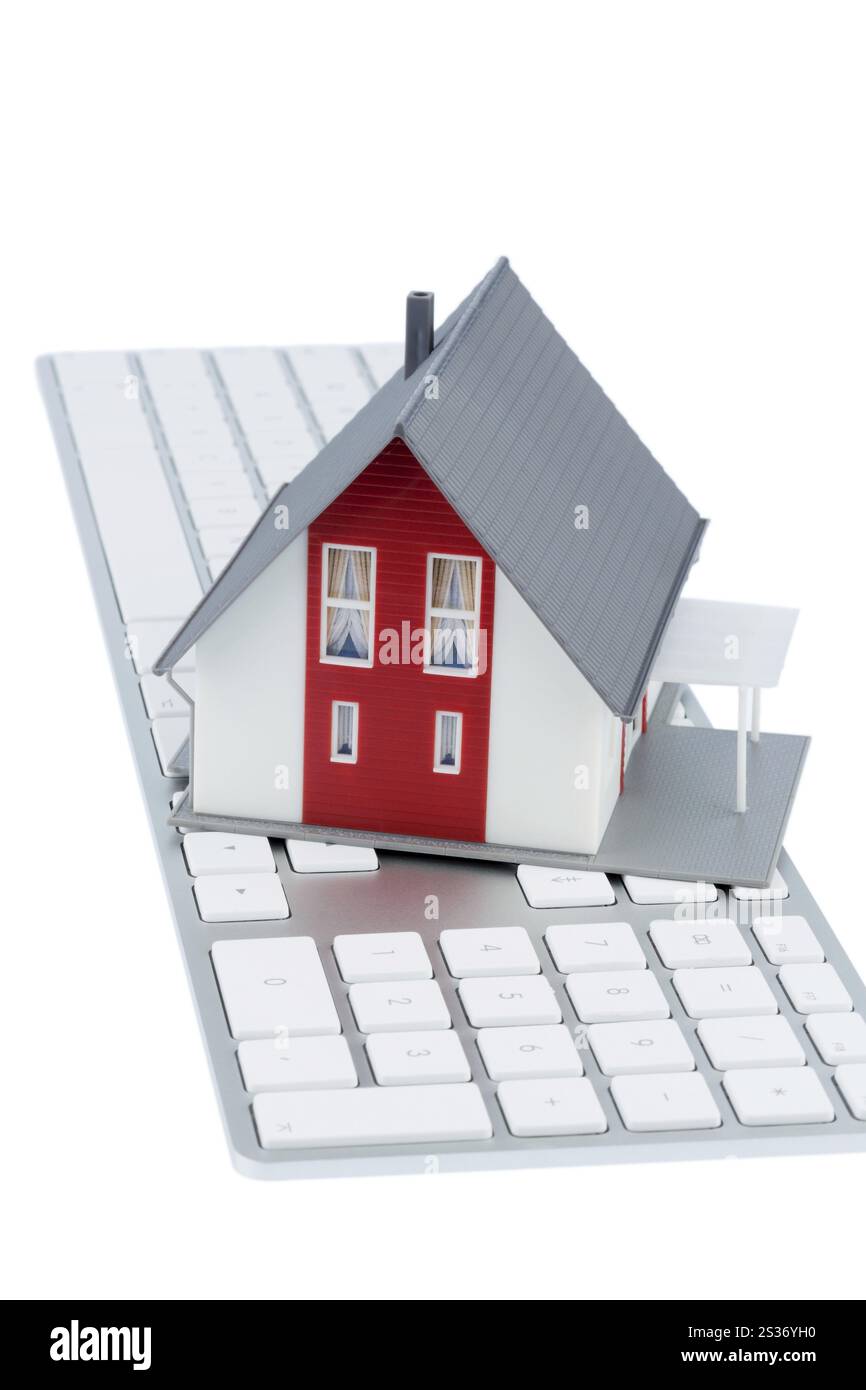 House on keyboard, symbolic photo for house purchase and rental via the ...