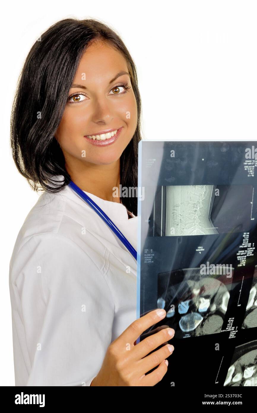 A doctor holds the X-ray image of an intervertebral disc infiltration ...