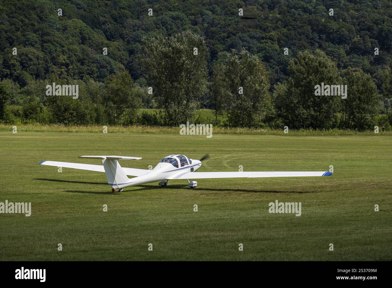 Glider taking off from an airfield with a runway Stock Photo - Alamy
