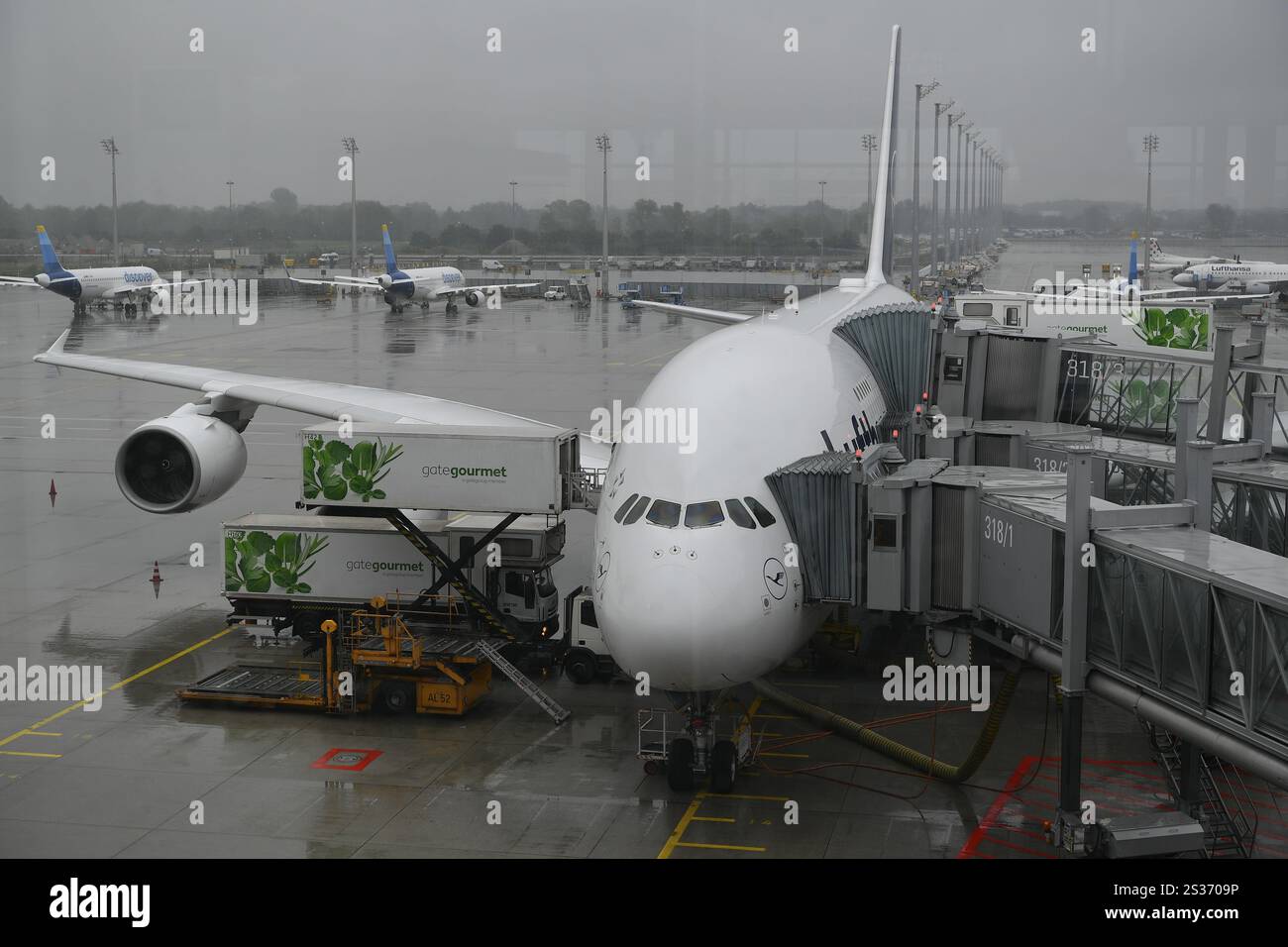 Lufthansa Airbus A380-800 in the rain at check-in position, satellite ...