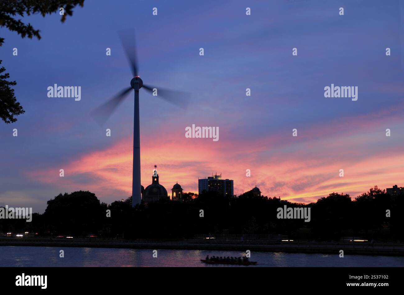 Wind turbine silhouette over red sunset sky in Toronto, Canada Stock ...