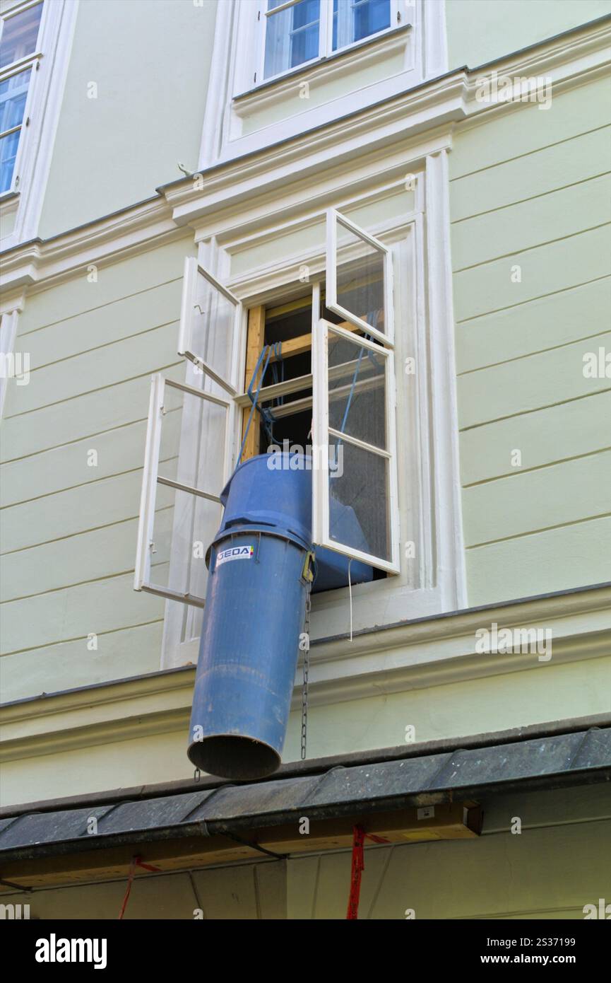 Chute for building rubble on residential building, symbolic photo for ...