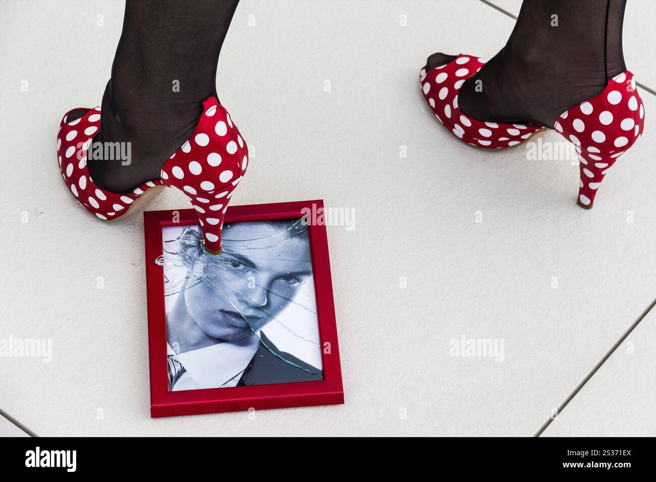 Broken picture frame and high heels. Symbolic photo for divorce ...