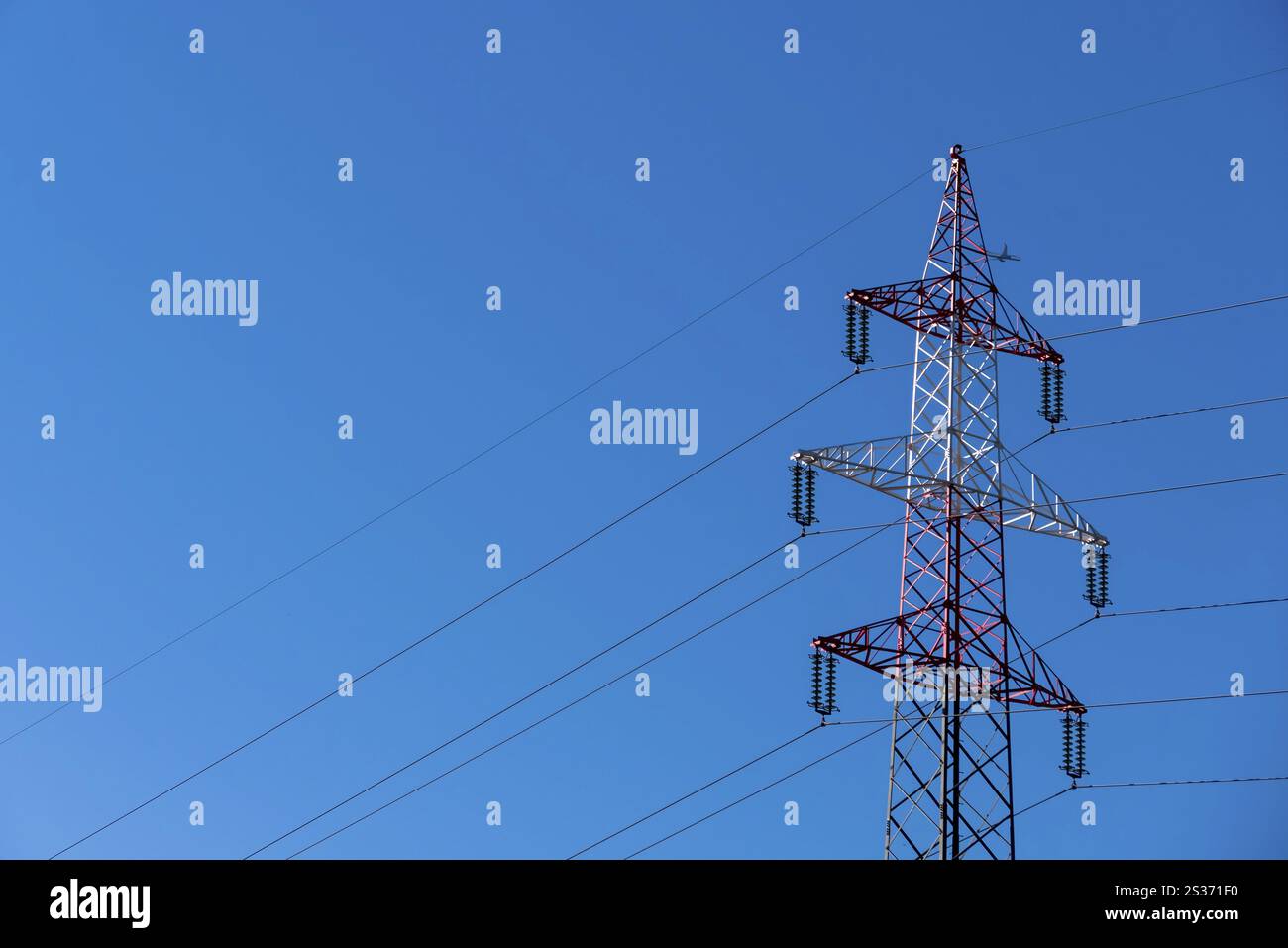 High-voltage pylon red and white, symbol for electricity, power supply ...