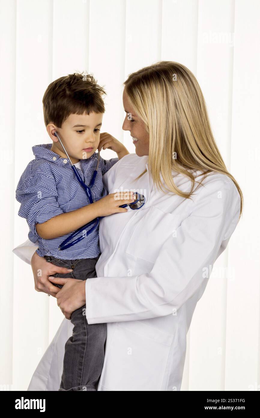 Doctor and little boy, symbol for diseases, diagnostics, heart defects ...
