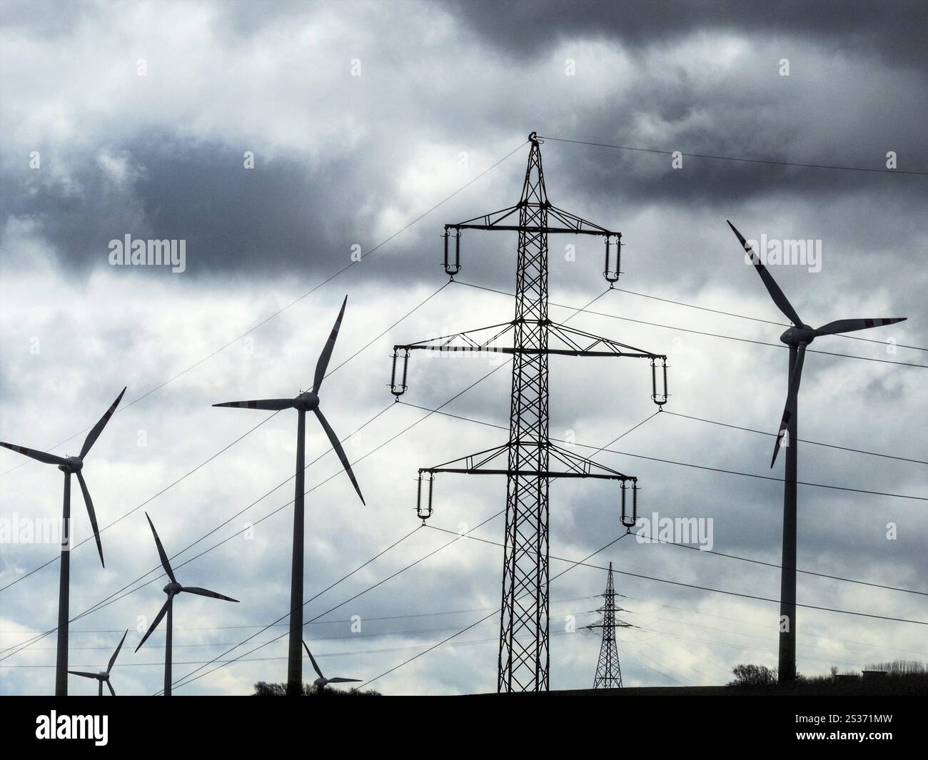 Wind turbines and electricity pylons in a wind farm. Wind power plant ...