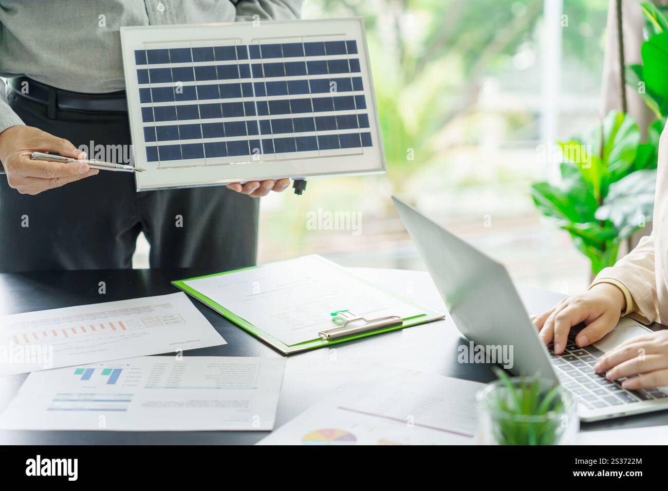 Solar panels green energy Business people working in green eco friendly ...