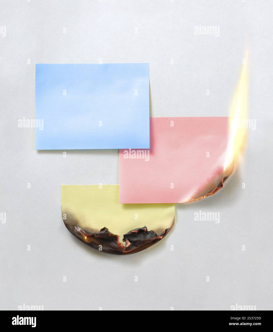 Burning post-it notes on a wall Stock Photo - Alamy