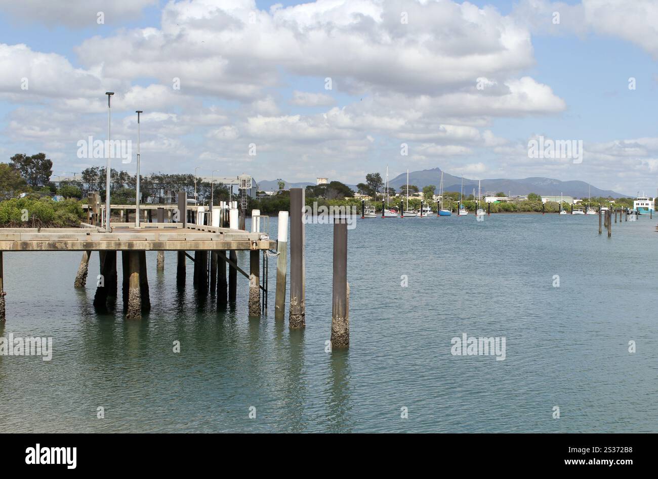 Jetty and boats at Auckland Creek in Gladstone, Queensland, Australia ...