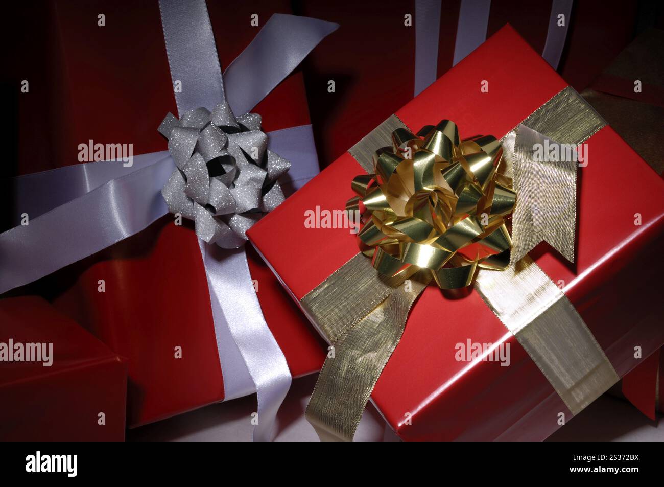 Christmas gift boxes shining in darkness Stock Photo - Alamy