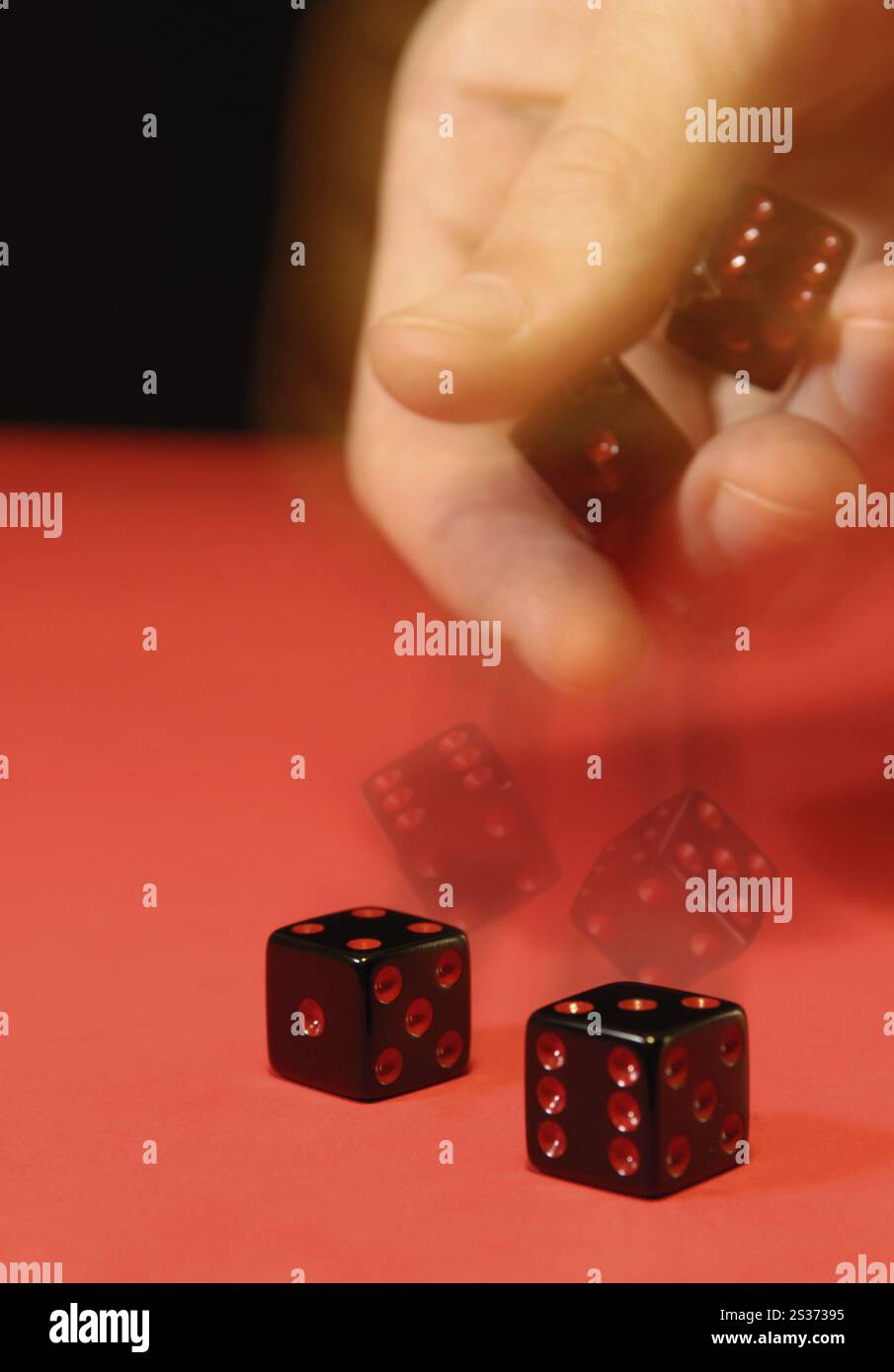 Hand rolling the dice Artistic multiple exposure image showing motion in action Stock Photo - Alamy