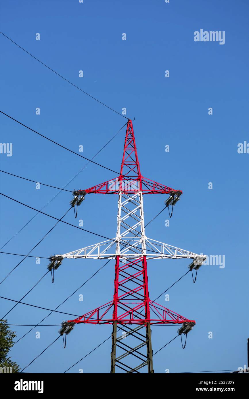 High-voltage pylon red and white, symbol for electricity, power supply ...
