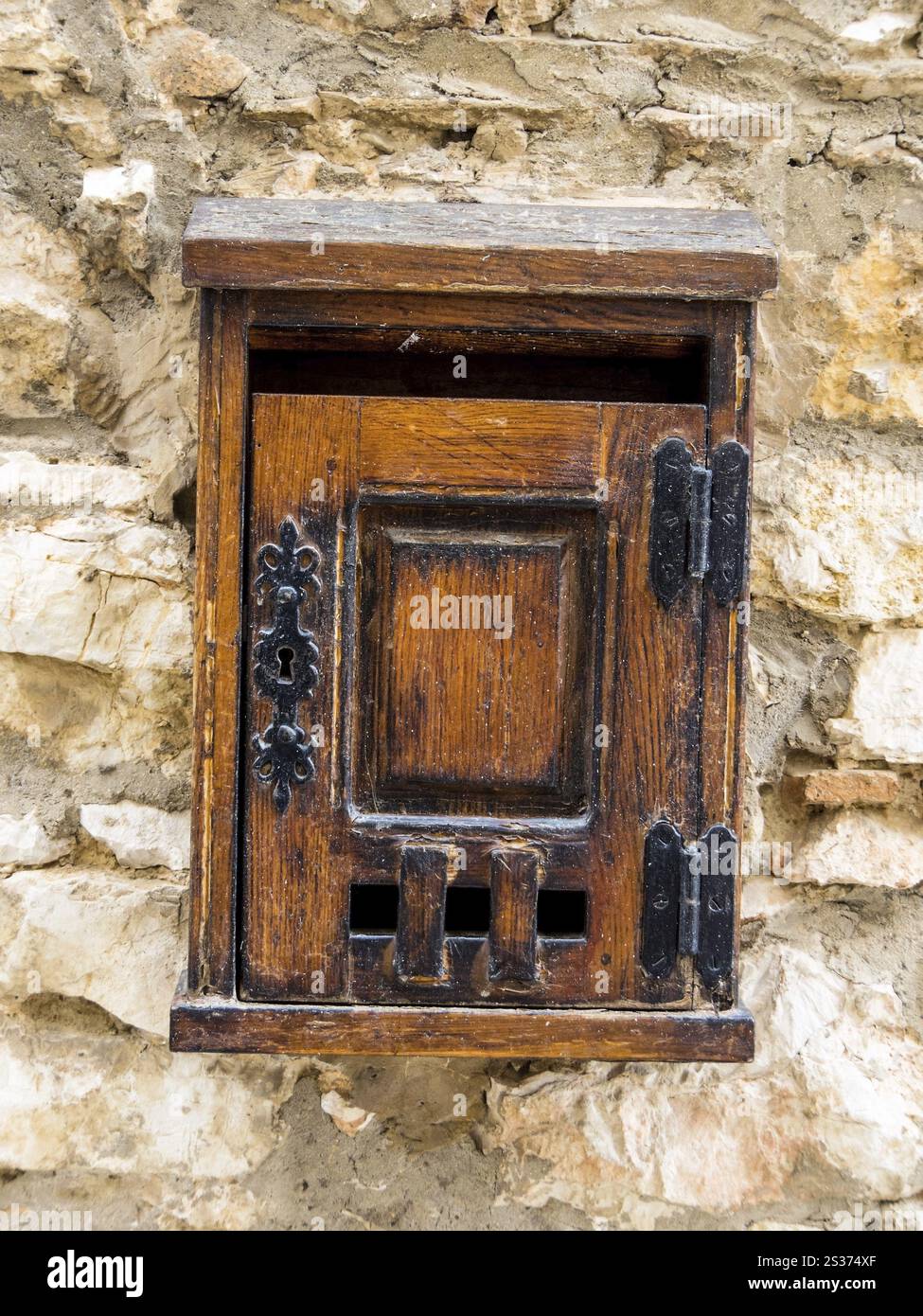 Old wooden letterbox on a house wall Stock Photo - Alamy