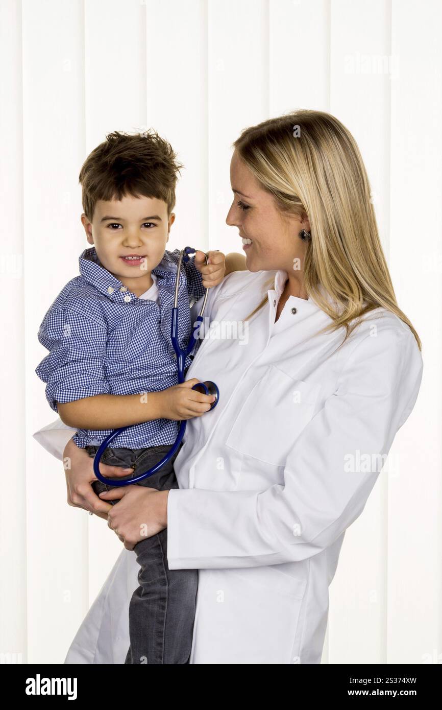 Doctor and little boy, symbol for diseases, diagnostics, heart defects ...