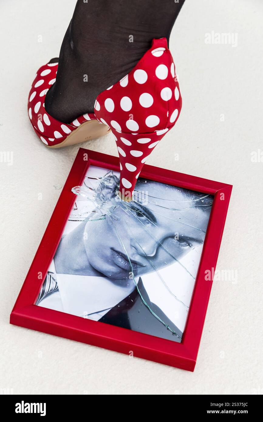 Broken picture frame and high heels. Symbolic photo for divorce ...