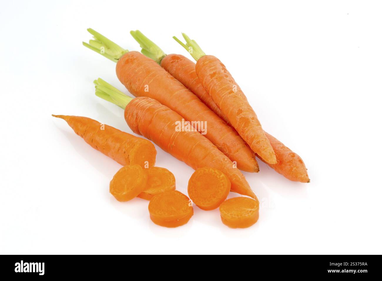 Organically grown carrots on a white background. Fresh fruit and ...