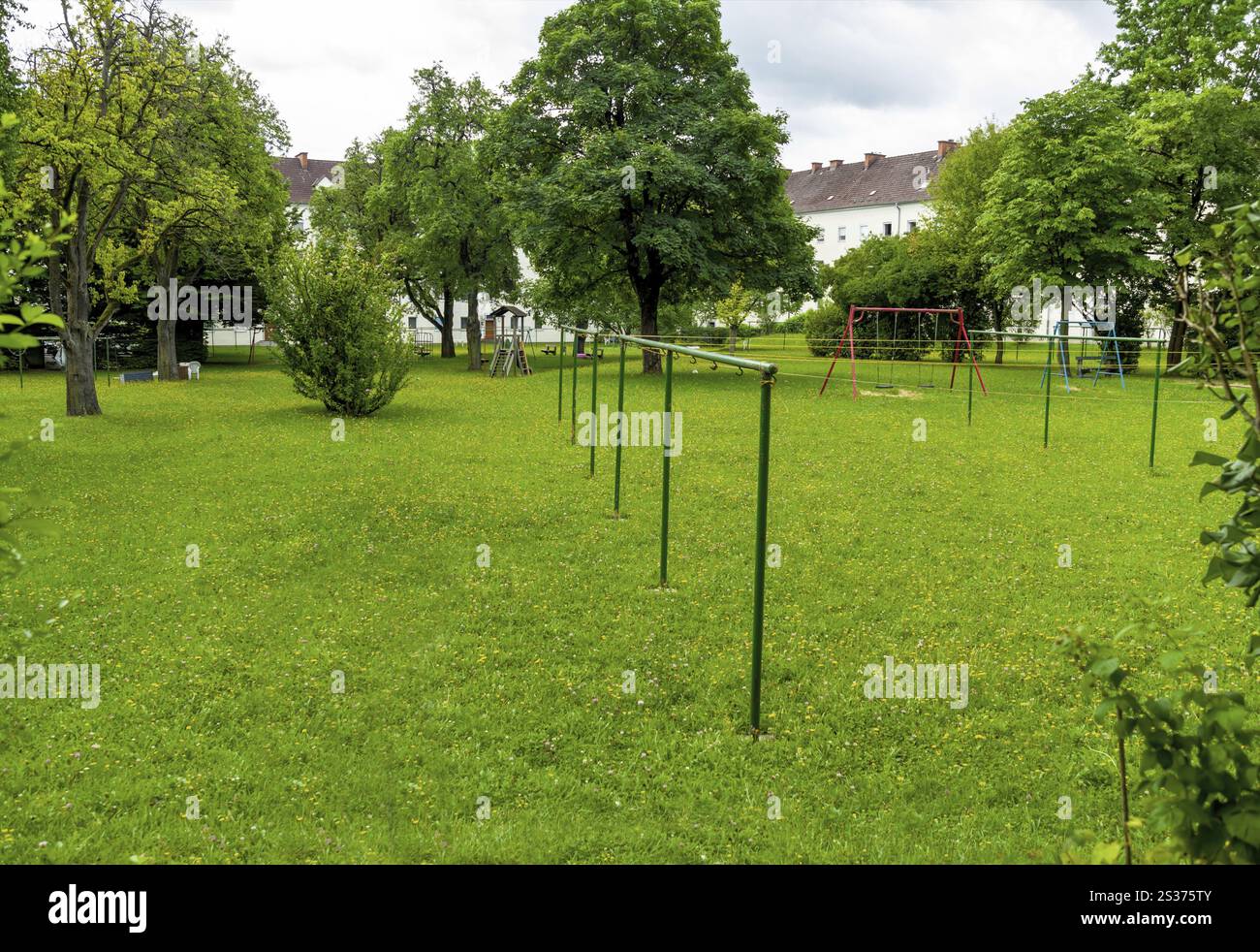 Backyard with playground, symbol of living, neighbourhood, recreation ...