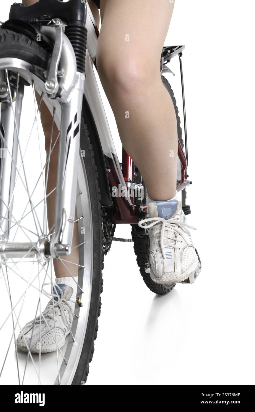 Young woman with a bike Closeup of legs Isolated silhouette on white ...