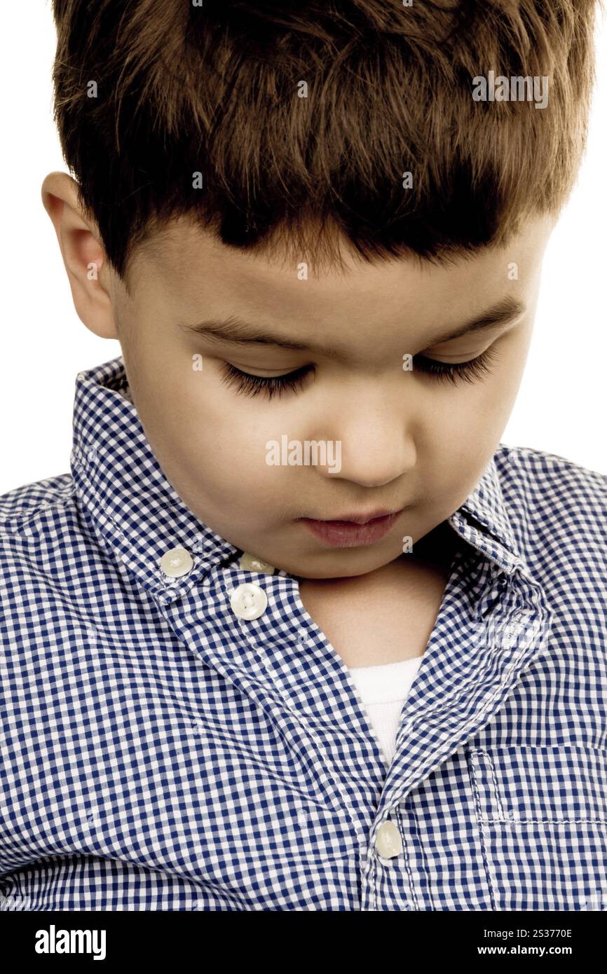Portrait of a little boy, symbolising childhood, insecurity, shyness ...