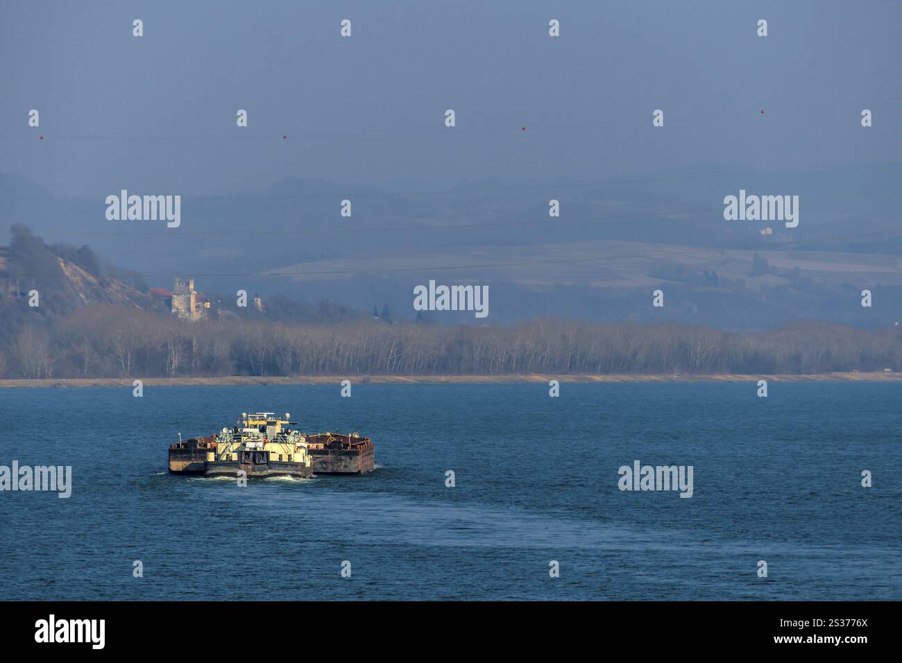 Freighter with bulk goods underway, symbol for shipping, freight ...