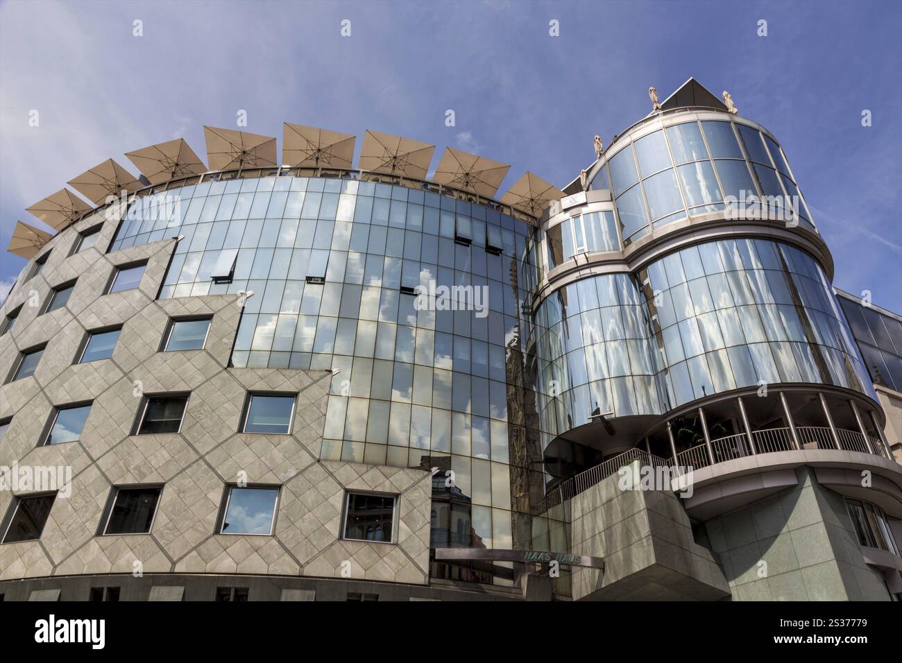 The Haas House in Vienna, Austria. Glass facade with reflection of ...