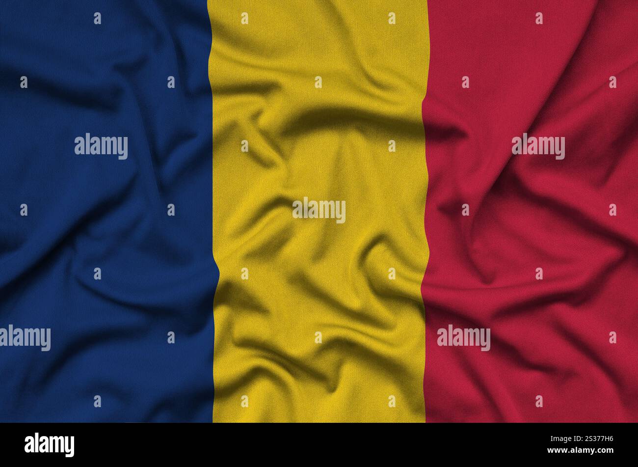 Chad flag is depicted on a sports cloth fabric with many folds. Sport ...