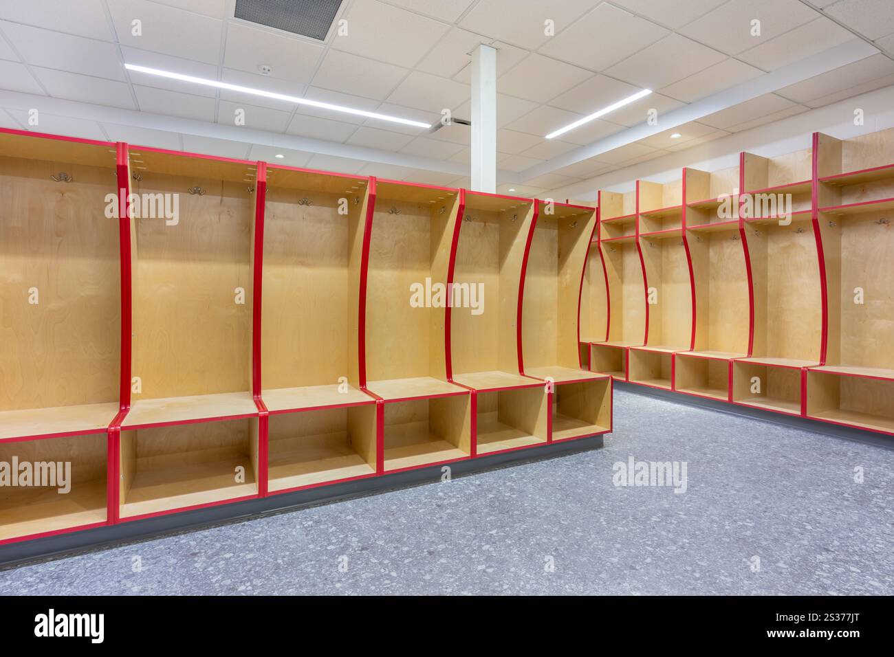 Empty team locker, changing room with traditional open wooden lockers ...