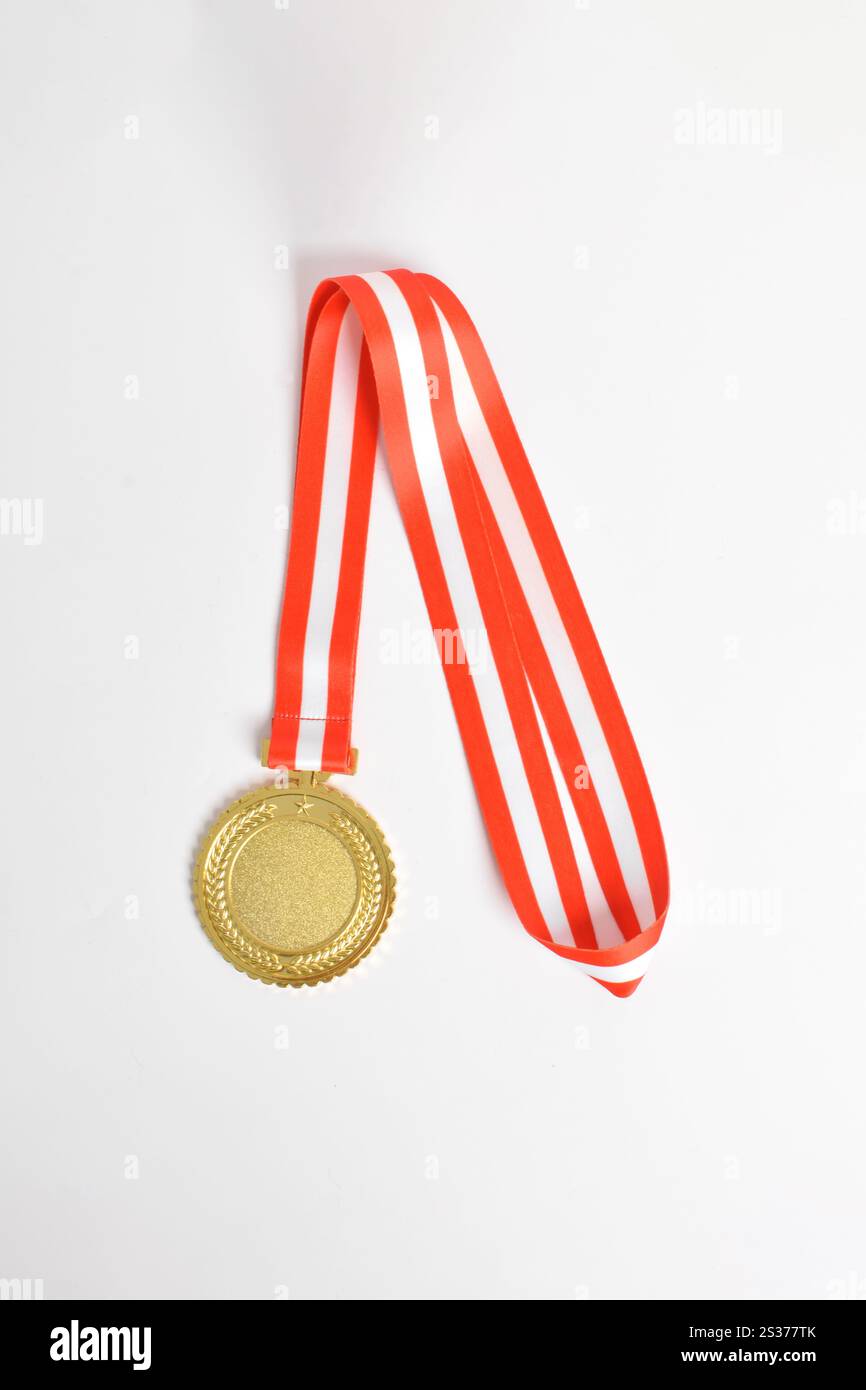 Gold medal with red and white ribbon isolated on white background ...