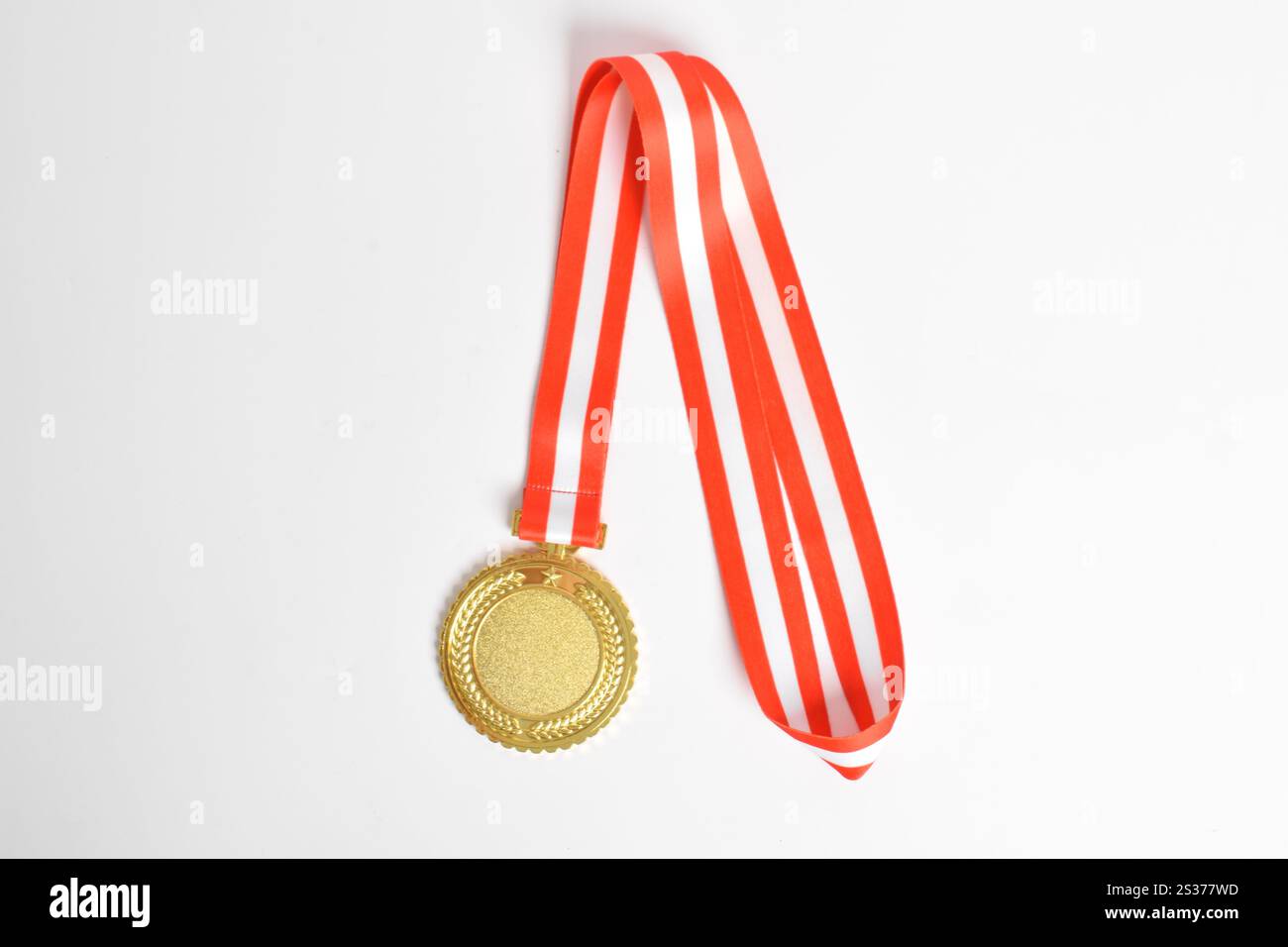 Gold medal with red and white ribbon isolated on white background ...