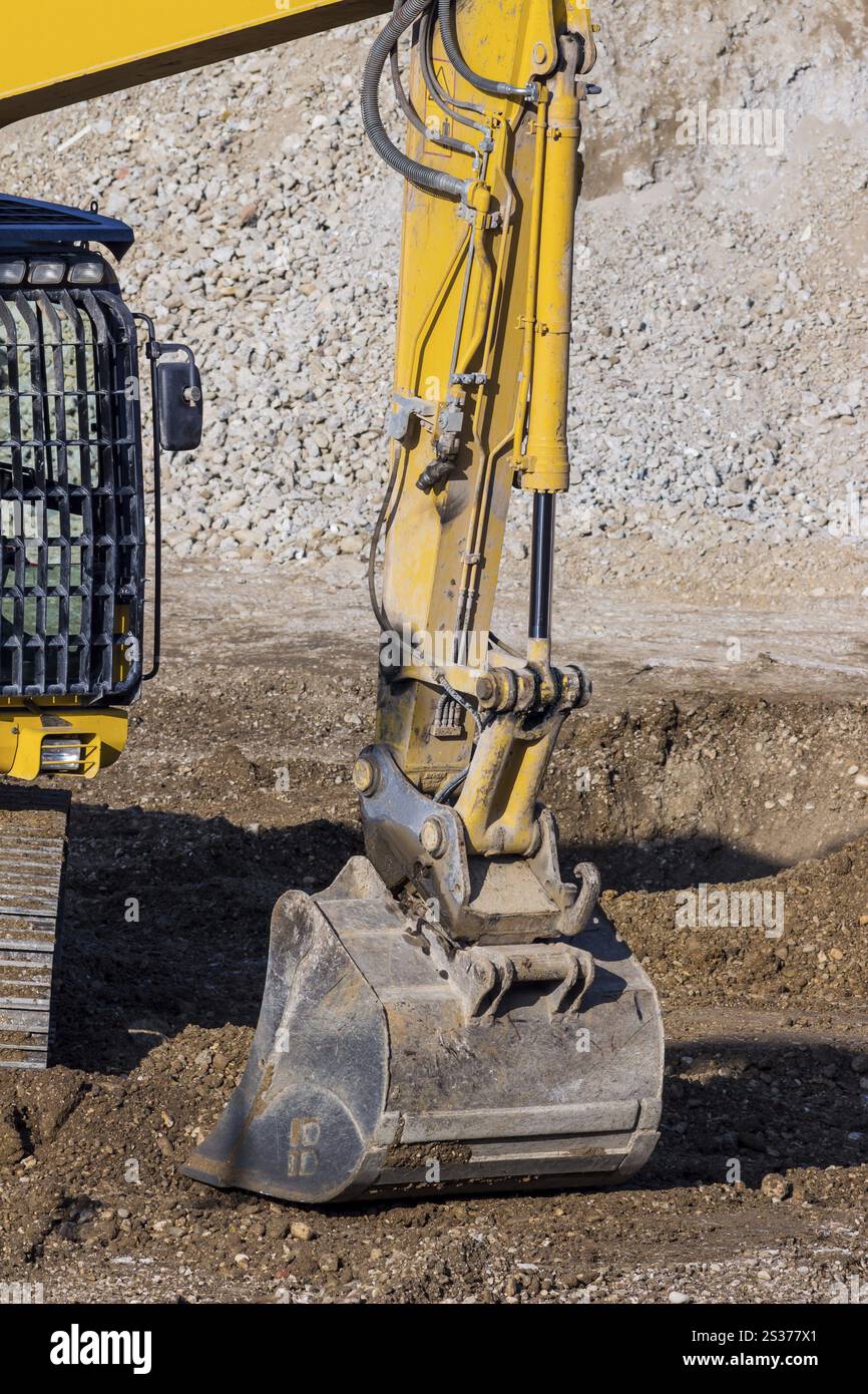 Excavator on a building site. Excavator shovel with earth, earthworks ...