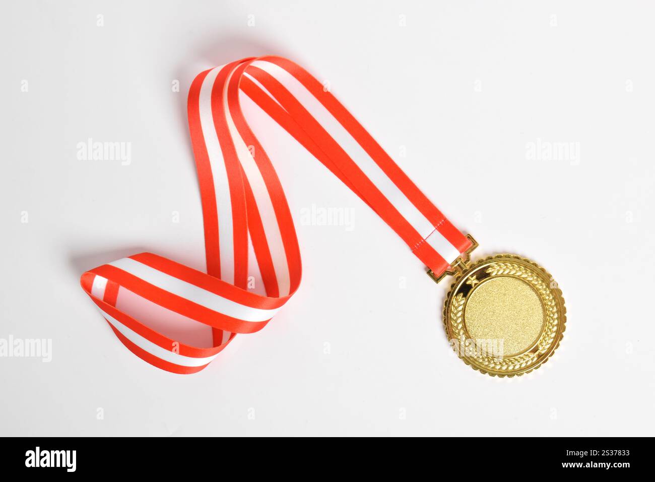 Gold medal with red and white ribbon isolated on white background ...