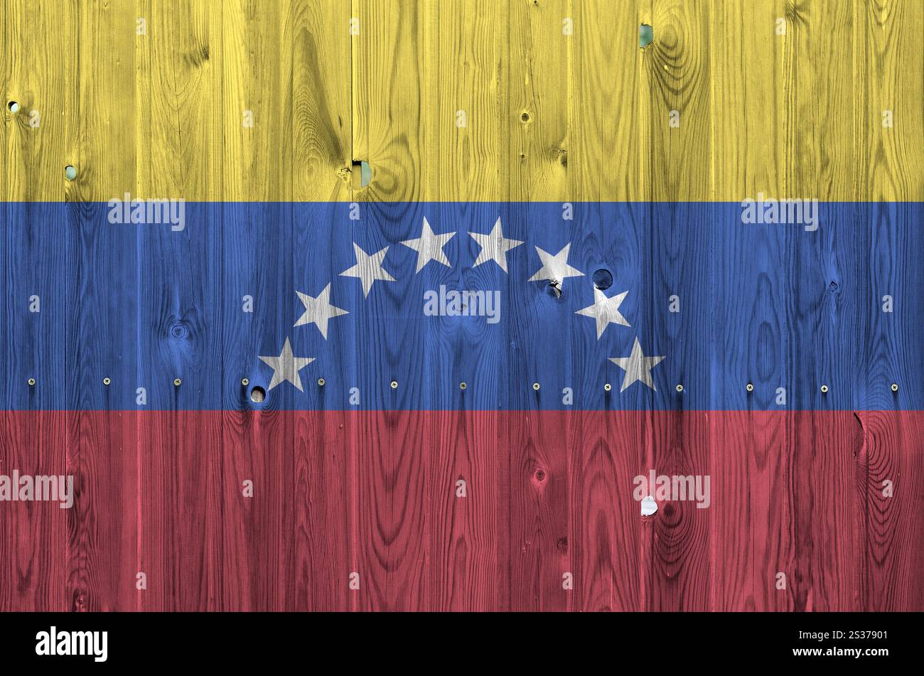 Venezuela flag depicted in bright paint colors on old wooden wall close ...