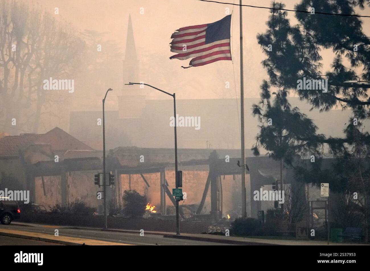 A tattered flag on E. Altadena Dr. during the Eaton Fire, Wednesday ...