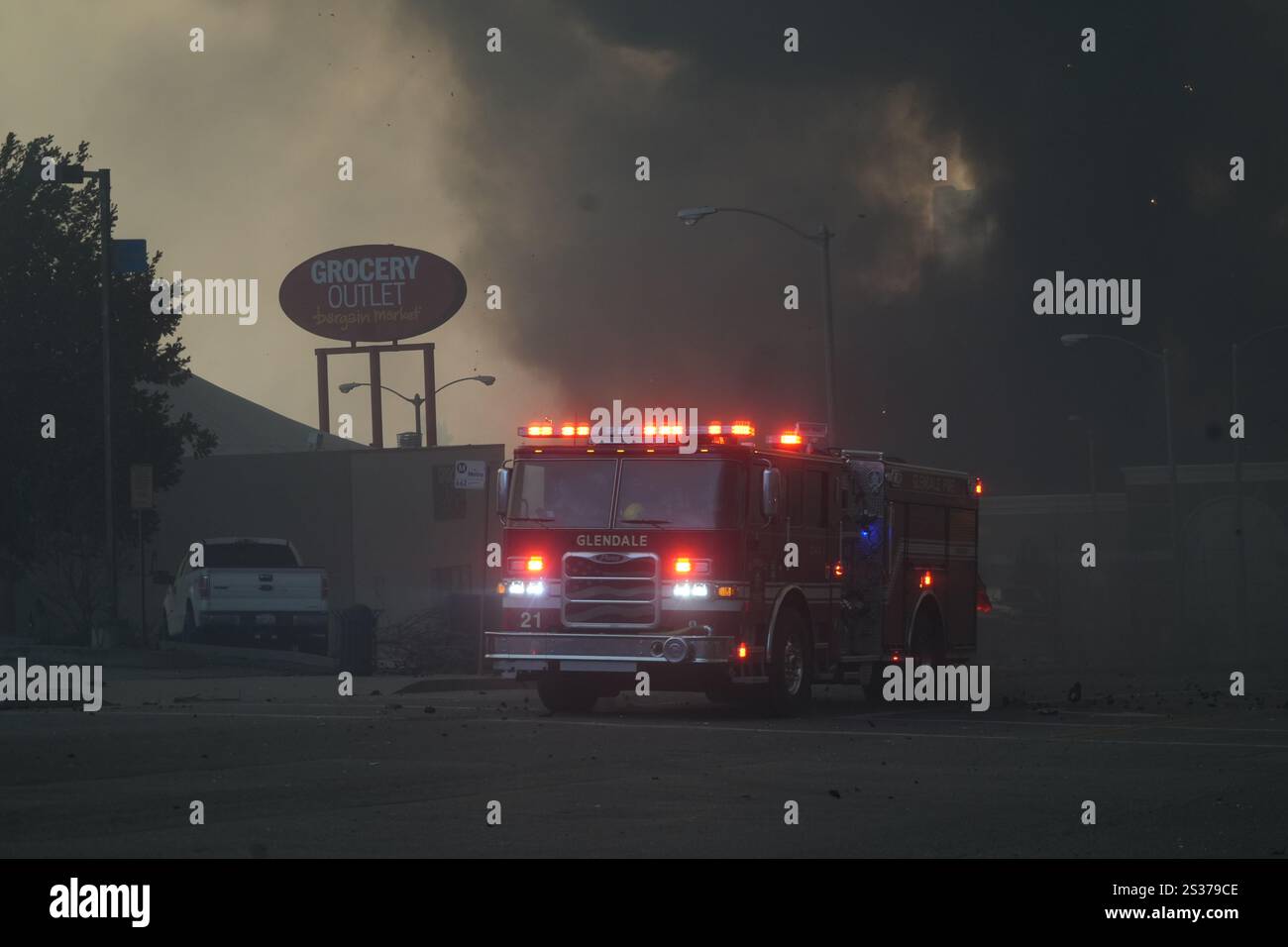 A Glendale Fire Dept. truck drives on Lake Ave. during the Eaton Fire ...