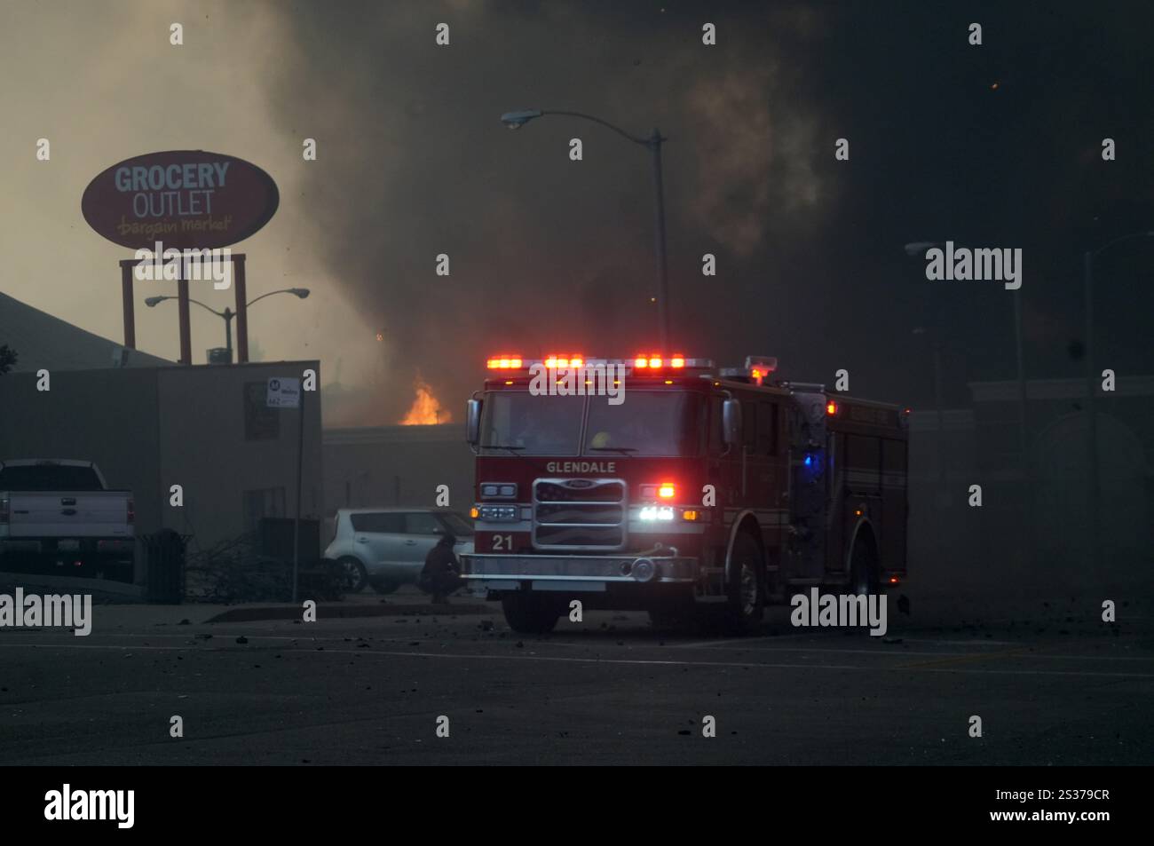 A Glendale Fire Dept. truck drives on Lake Ave. during the Eaton Fire ...