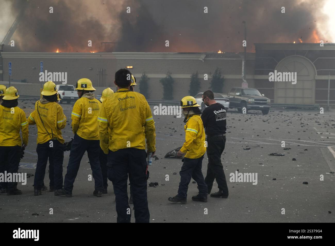 Pasadena Fire Dept. members watch as the Aldi USA grocery store burns ...