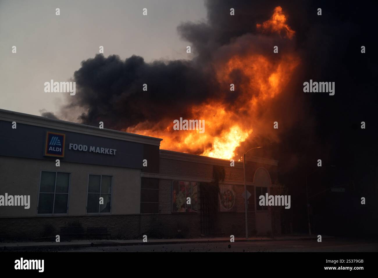 An Aldi USA grocery store burns during the Eaton Fire, Wednesday, Jan ...