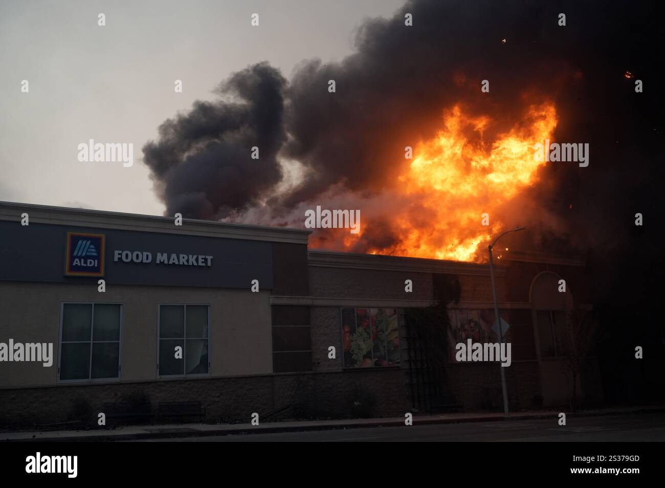 An Aldi USA grocery store burns during the Eaton Fire, Wednesday, Jan ...