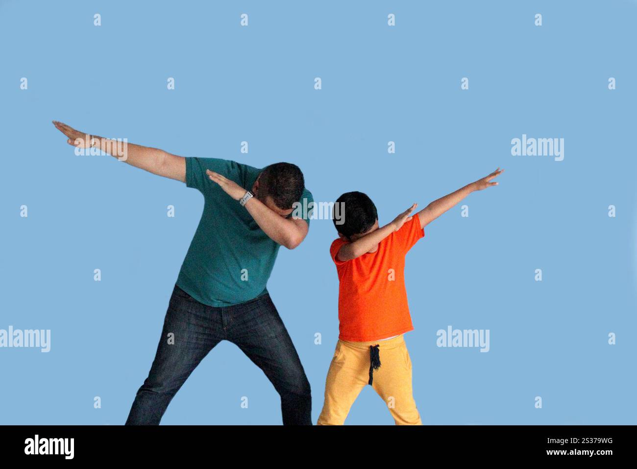 Divorced single dad with his 9-year-old dark-skinned Latino son dance ...