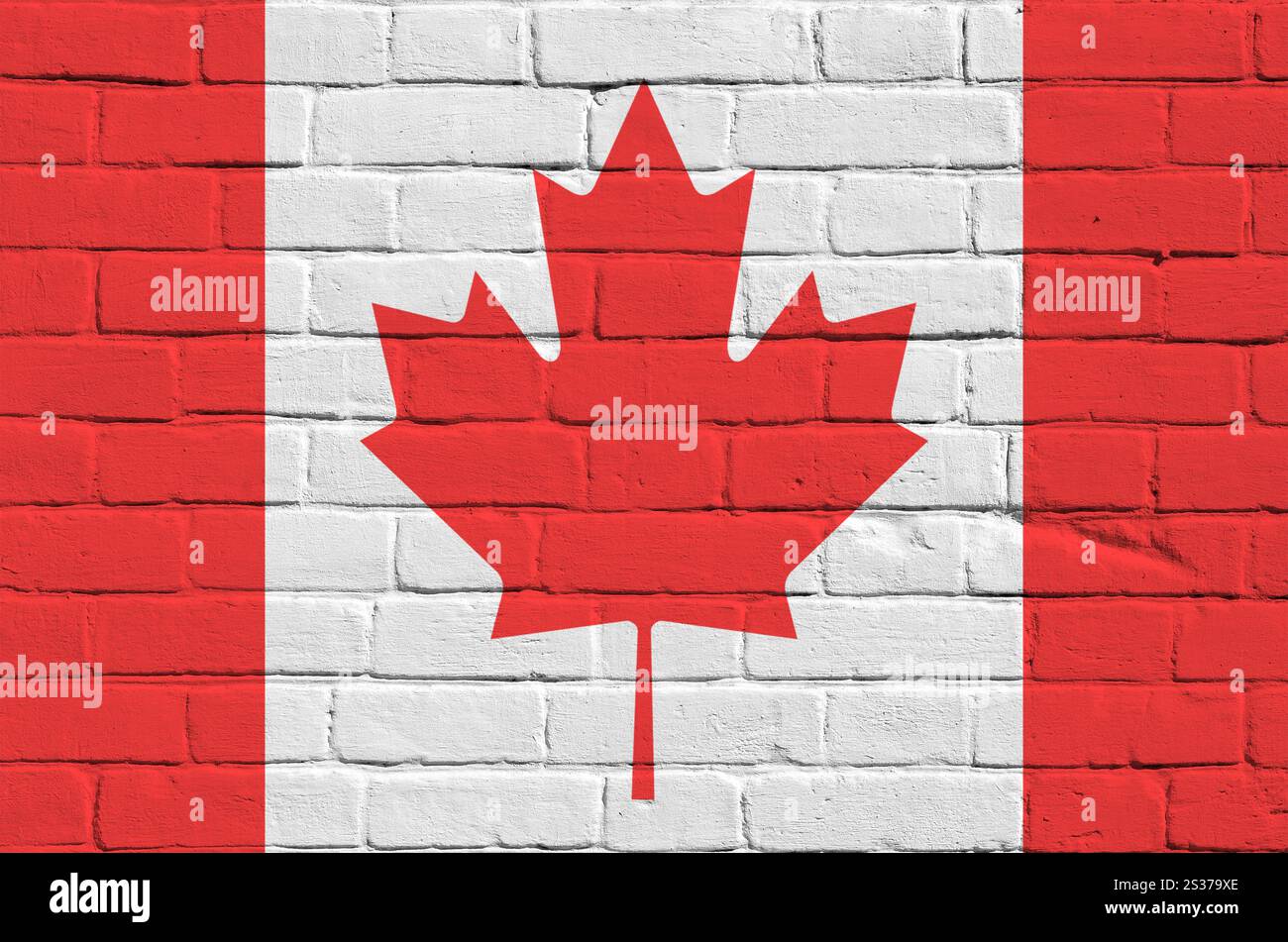 Canada flag depicted in paint colors on old brick wall close up ...