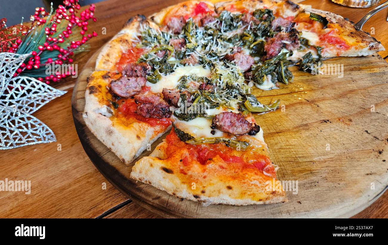 Pizza made with a circular flat wheat flour dough topped with tomato ...