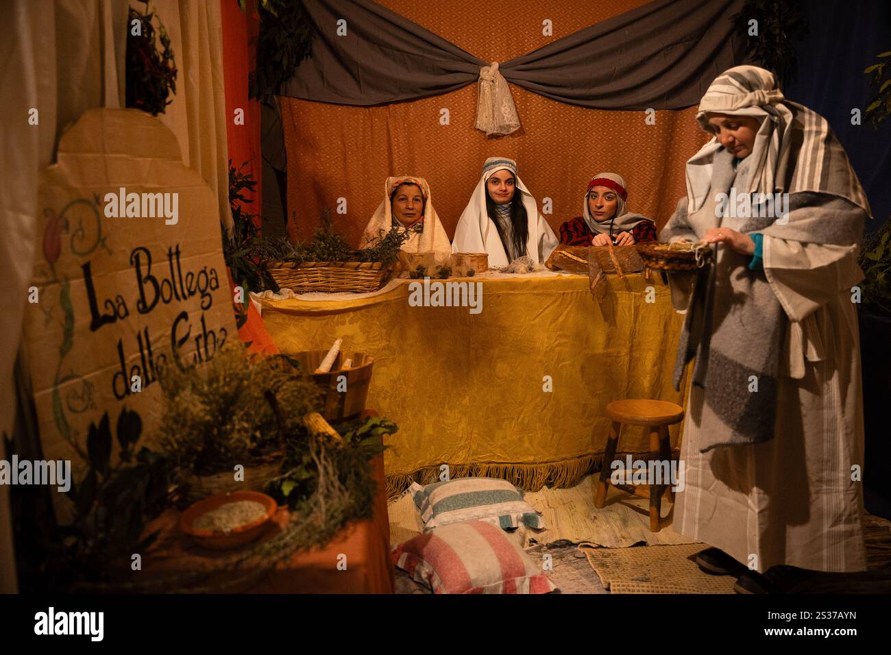 Women are seen working at the herb shop during the Living Nativity ...