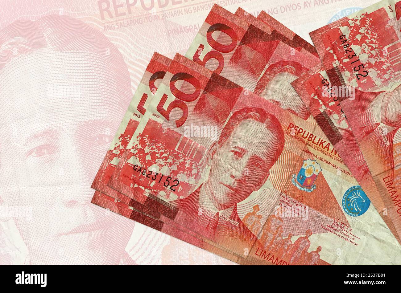 50 Philippine piso bills lies in stack on background of big semi ...