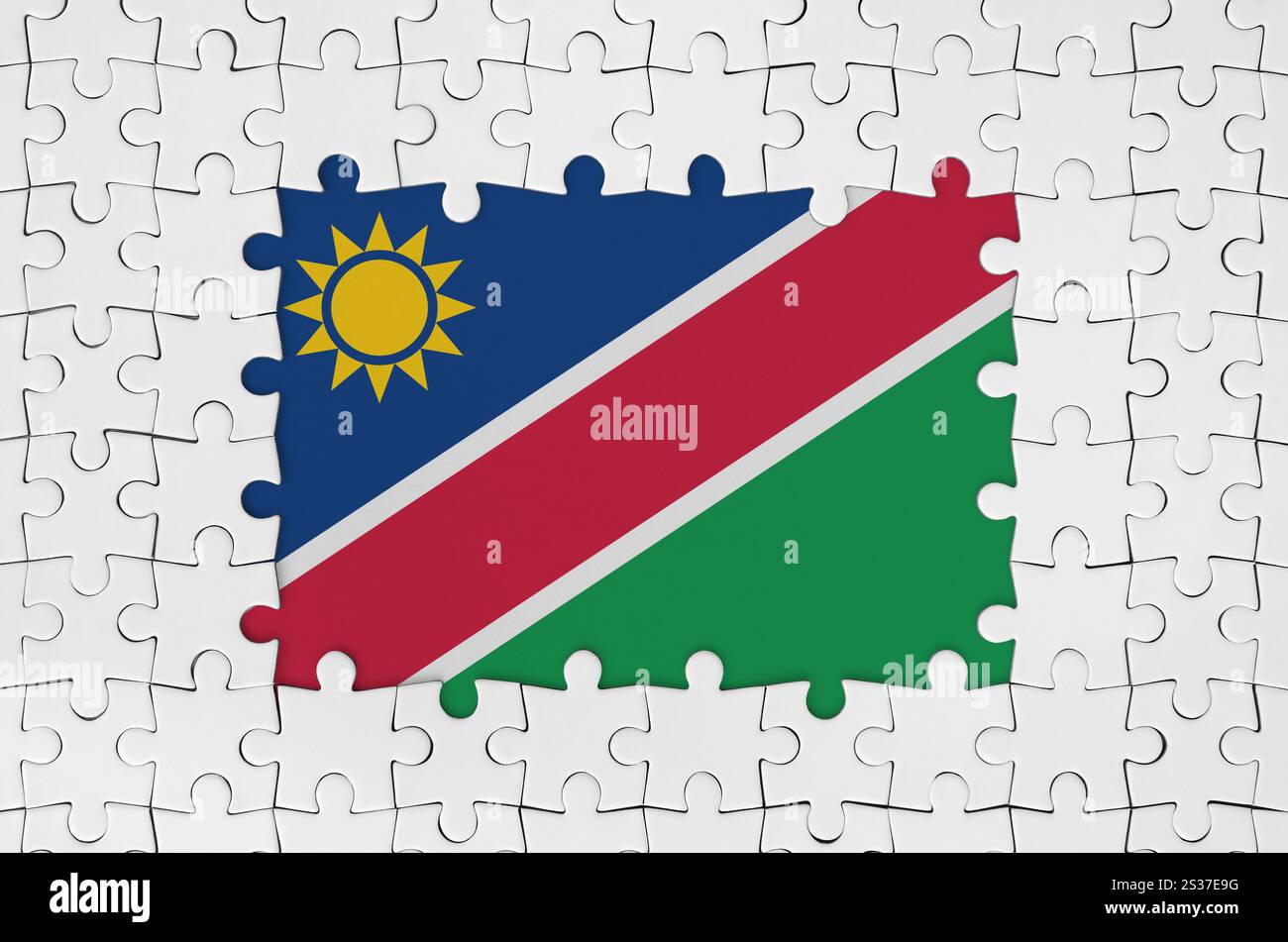 Namibia flag in frame of white puzzle pieces with missing central parts ...
