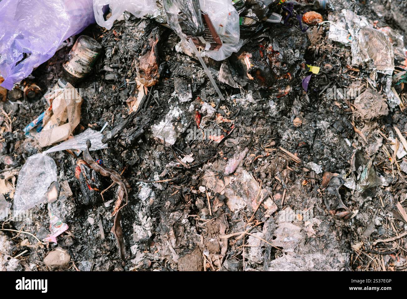 The remnants of burned trash highlight the environmental impact of ...