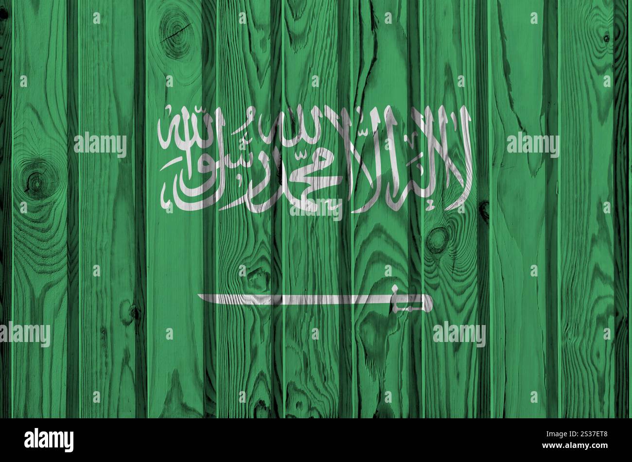 Saudi Arabia flag depicted in bright paint colors on old wooden wall ...