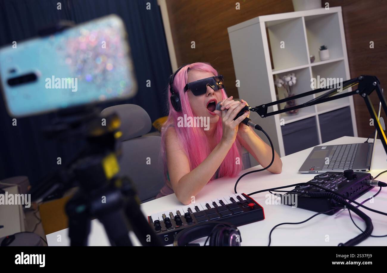 Beautiful young singer and musician broadcast from her home studio ...