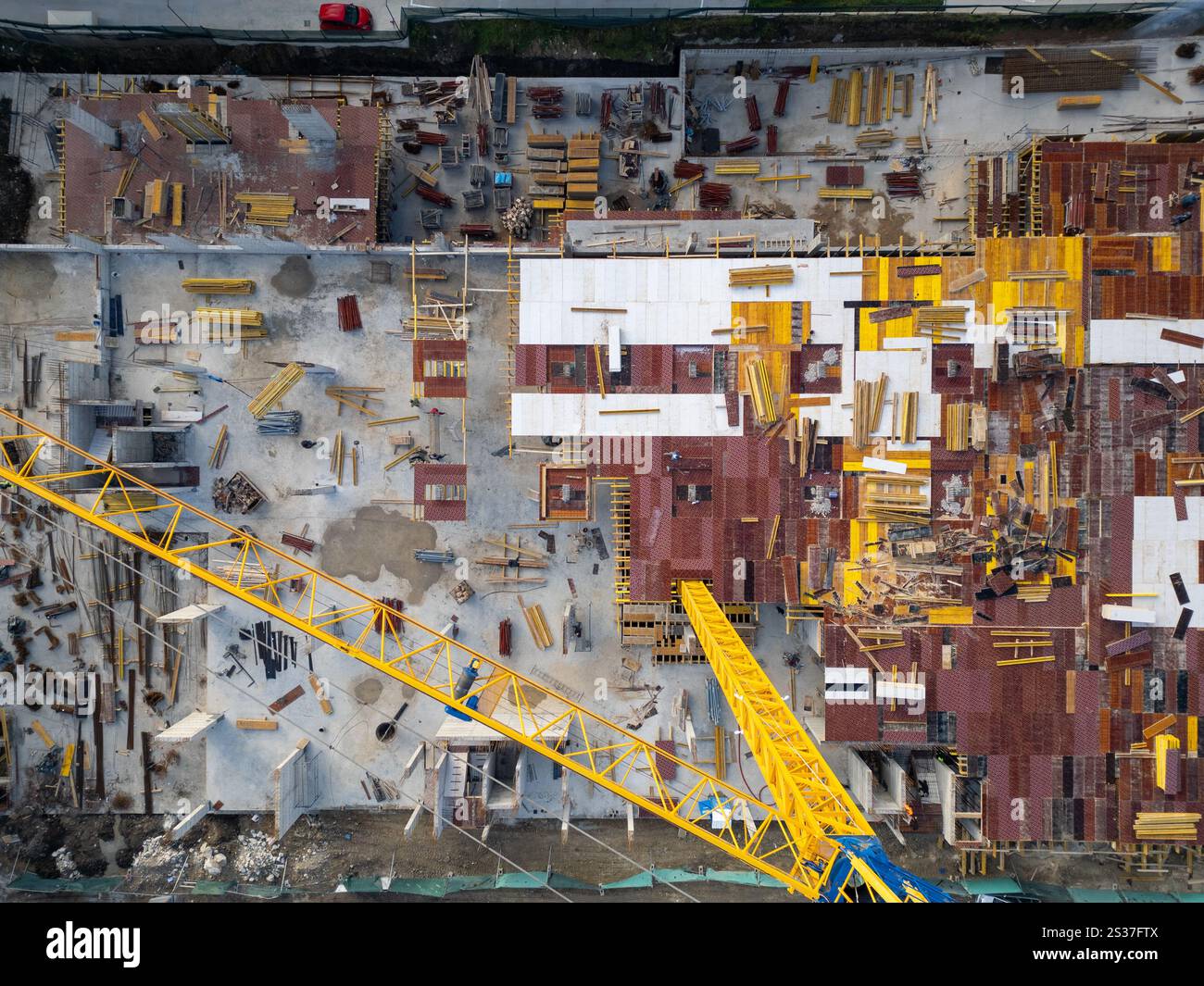 Construction site featuring machinery and building materials during ...