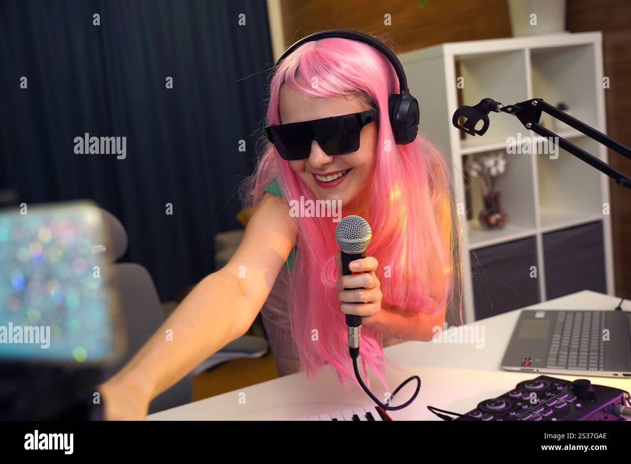 Beautiful young singer and musician broadcast from her home studio ...